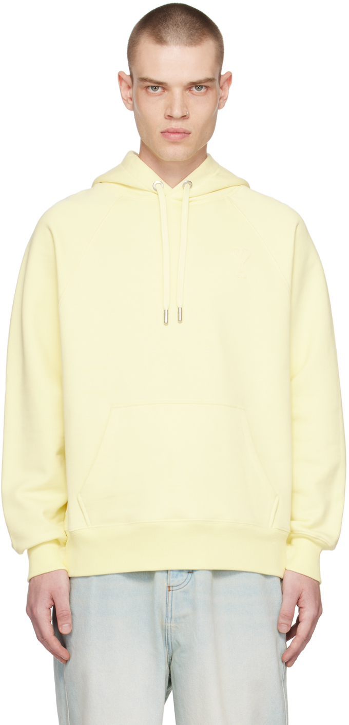 AMI Paris: Pull à capuche jaune à logo Ami de cœur exclusif à SSENSE ...