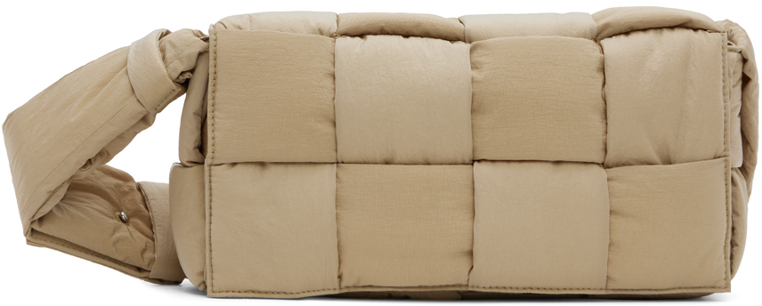 Bottega Veneta: Beige Padded Tech Cassette Bag | SSENSE