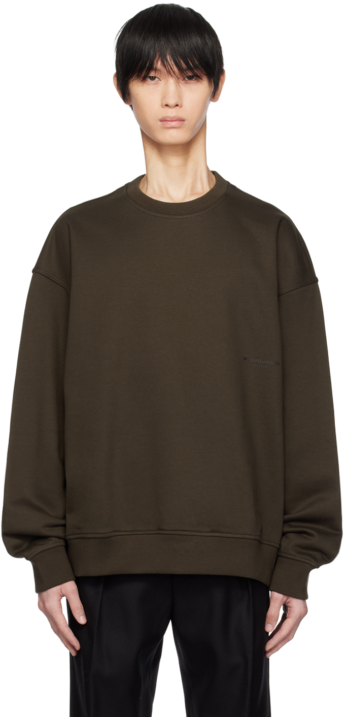 WOOYOUNGMI: Pull molletonné brun à écusson en cuir | SSENSE France