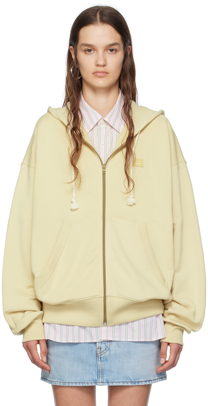 Acne Studios: Pull à capuche jaune à glissière | SSENSE France