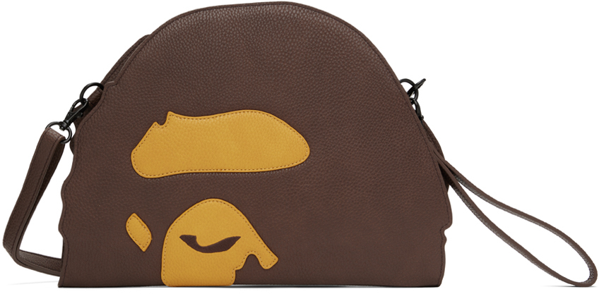 BAPE: Brown Ape Head Pouch | SSENSE Canada