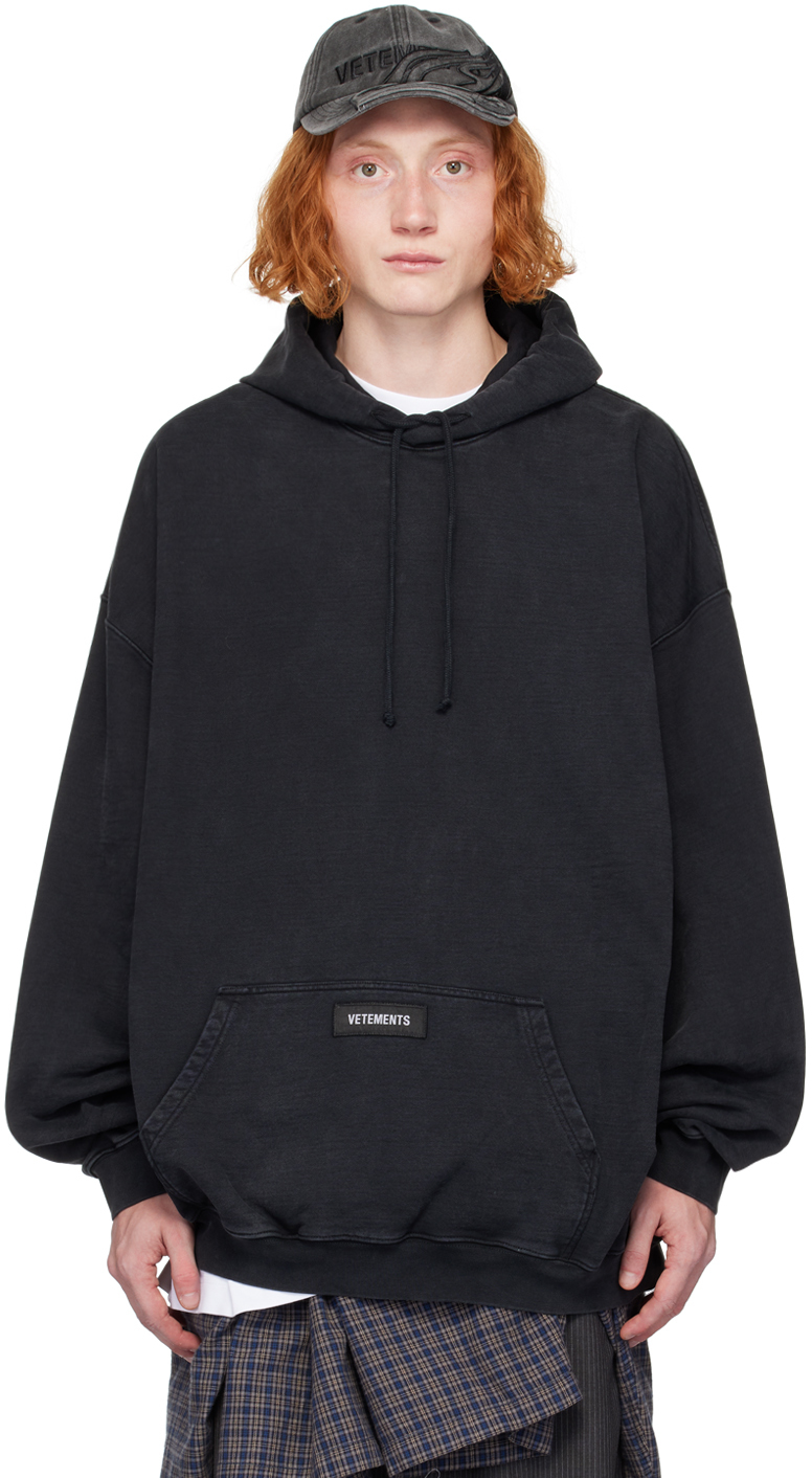 VETEMENTS: Black Woven Label Hoodie | SSENSE